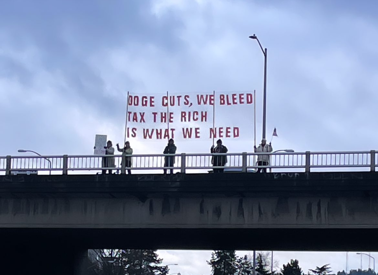 50th & I-5 Afternoon Overpass Banner Team - Backbone Campaign