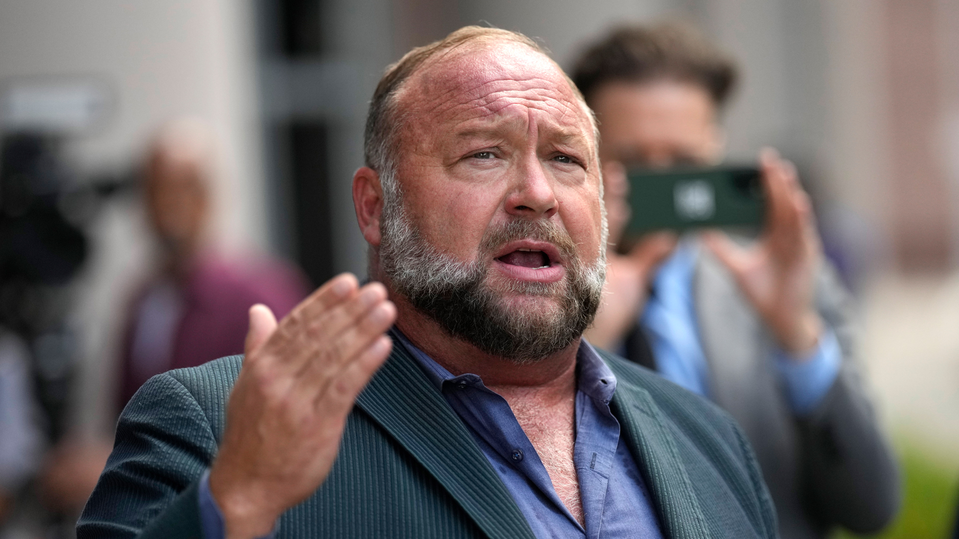 Sandy Hook families want Alex Jones' social media accounts seized ...